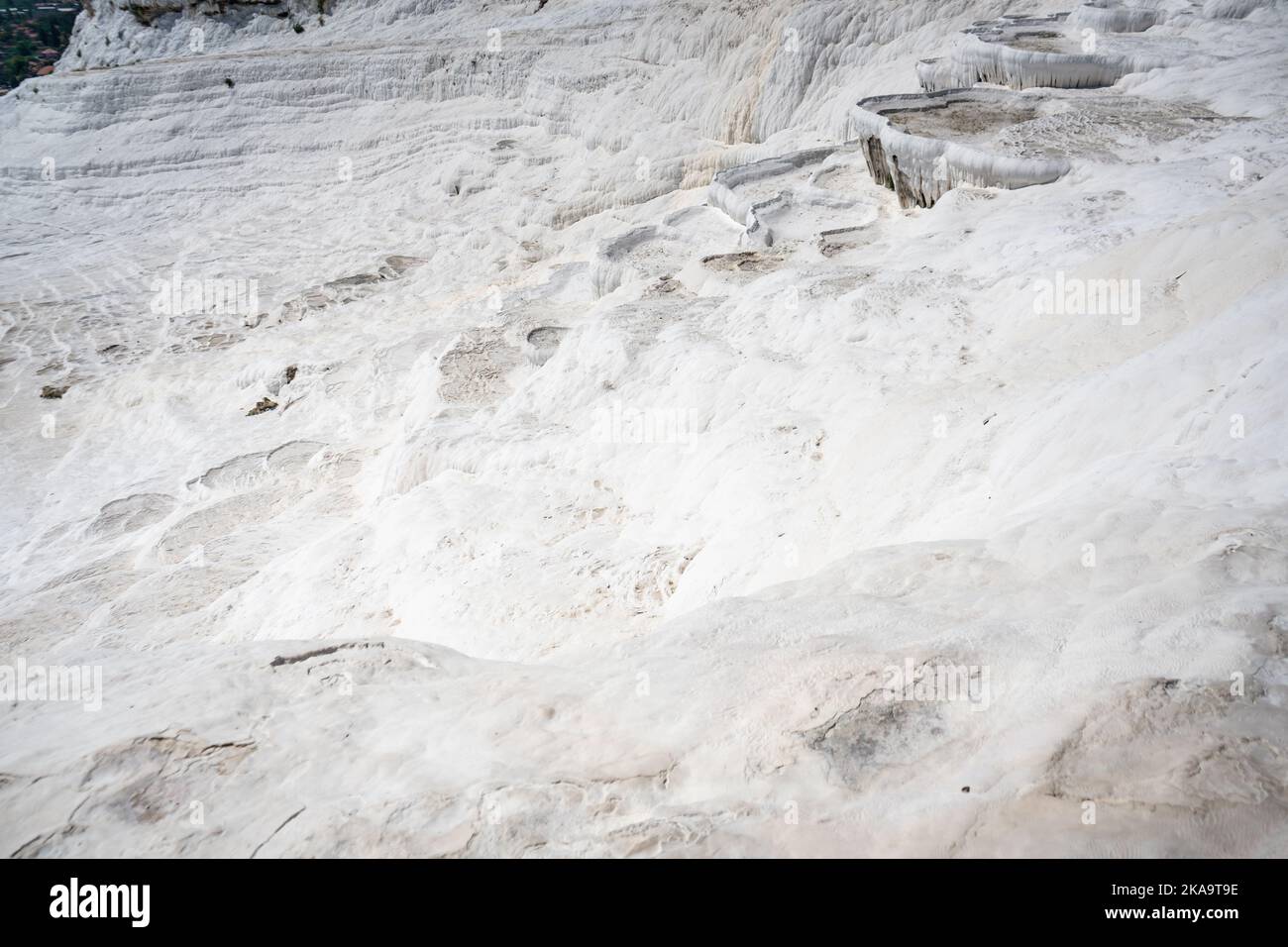 Calcite cliff of Pamukkale, white travertines in Turkey Stock Photo - Alamy