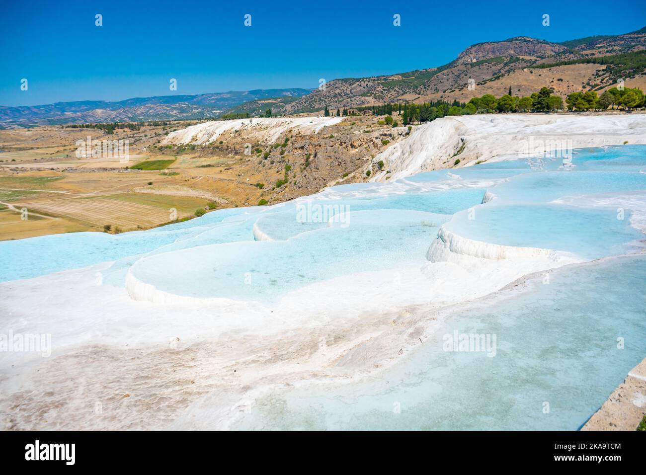 White travertines, calcite cliff of Pamukkale in Turkey Stock Photo - Alamy
