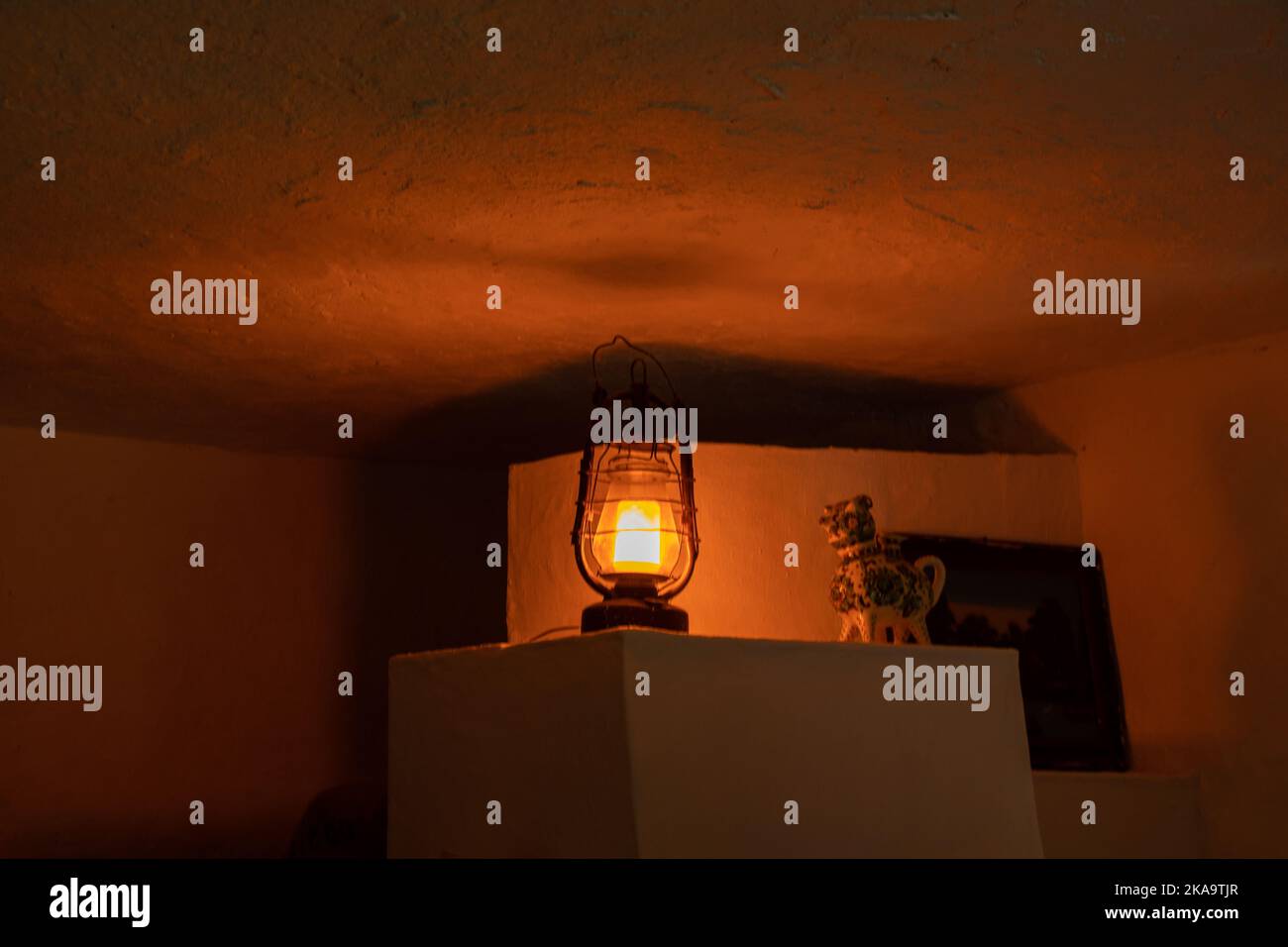 A kerosene lamp stands in a rural house on a stove in Ukraine ...
