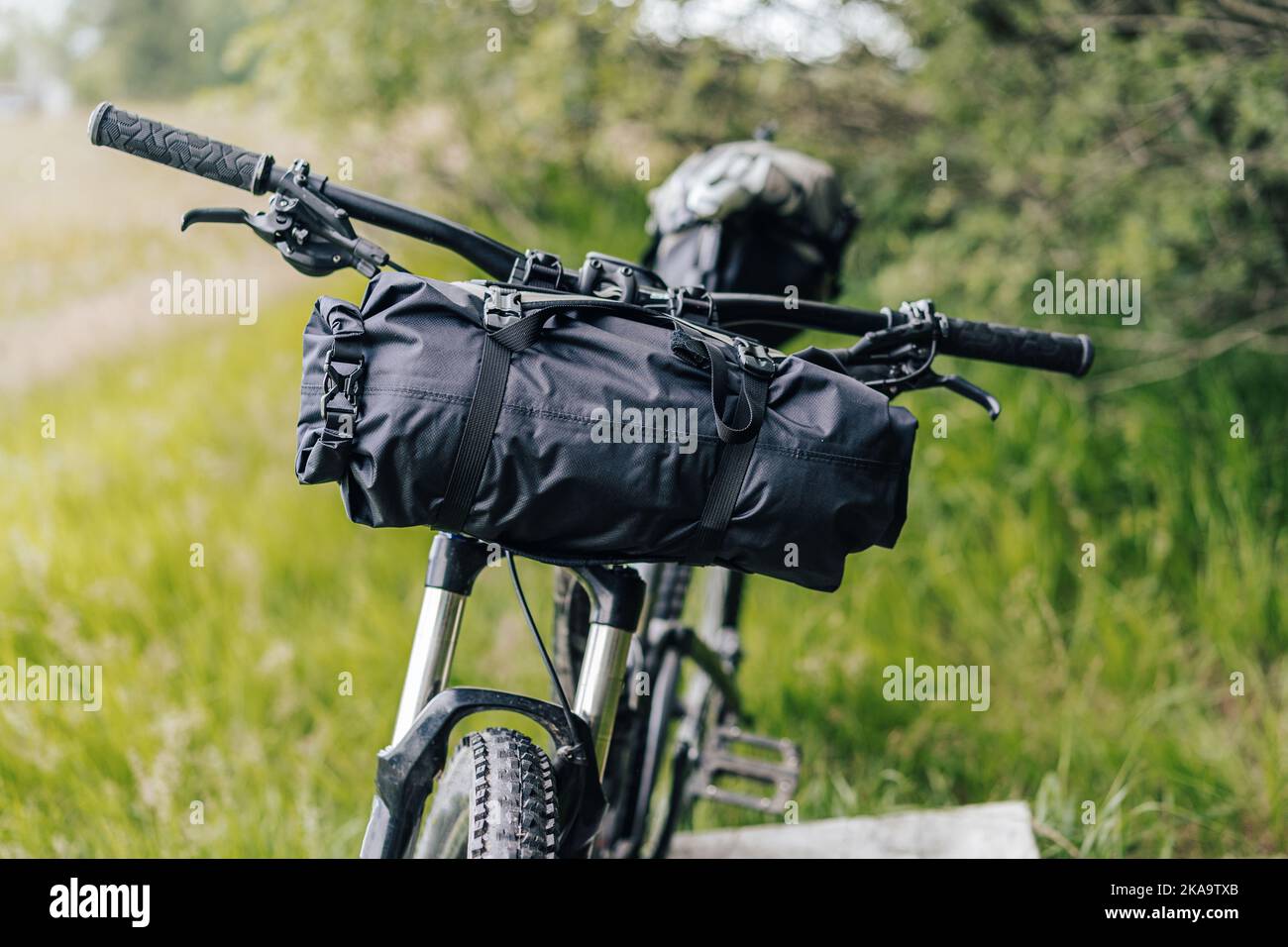 Bikepacking equipment on a mountain bike. Mountain bike with packed ...
