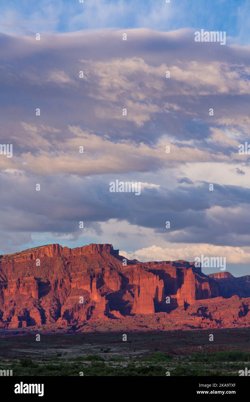 Clouds over Wray Mesa & the Fisher Towers at sunset near Moab, Utah ...