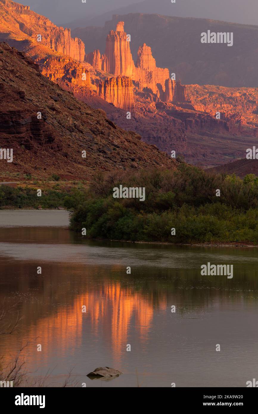 Storm clouds and sunset light on the Fisher Towers over the Colorado ...