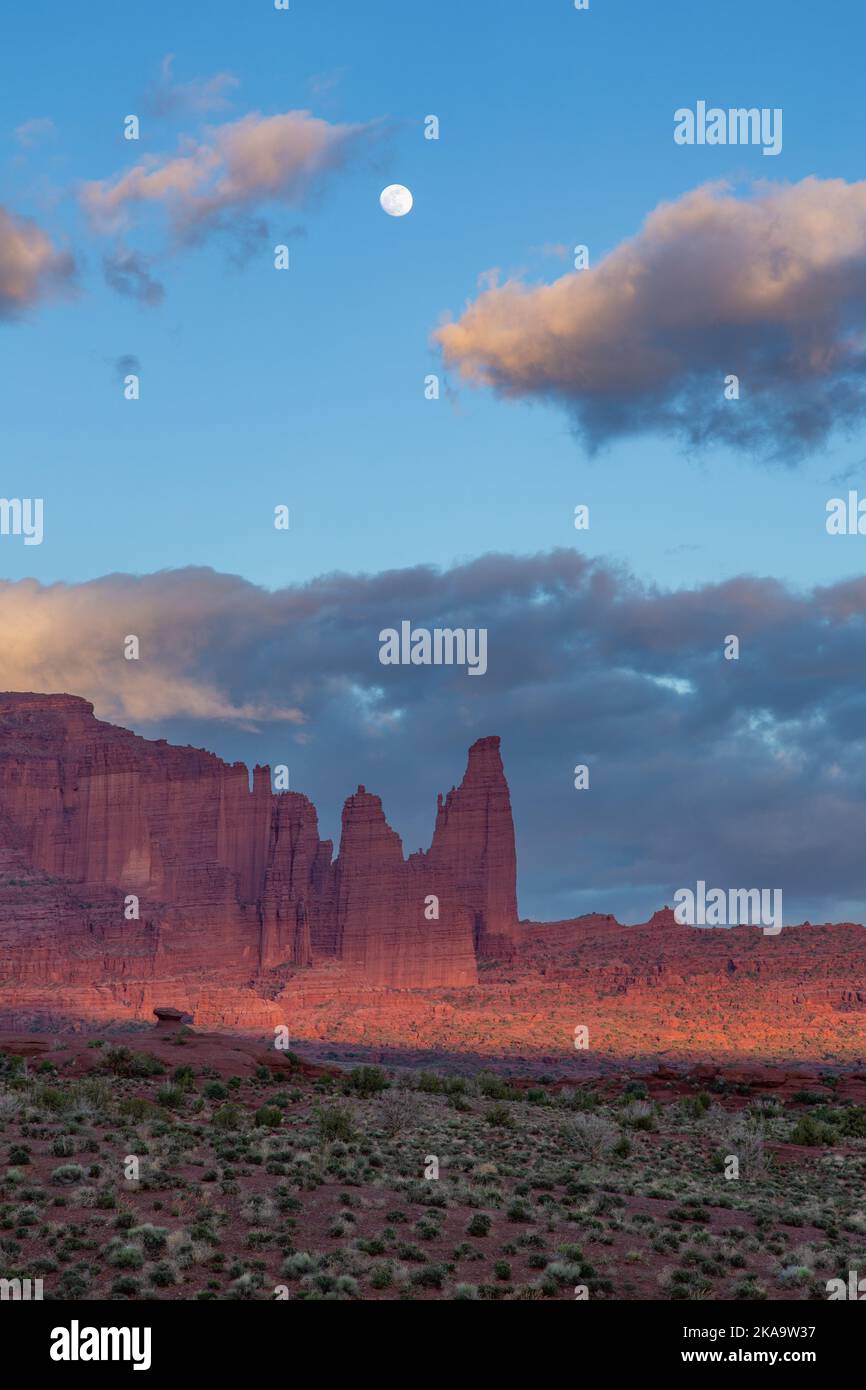 Rising moon over the Fisher Towers, eroded Cutler sandstone rock ...