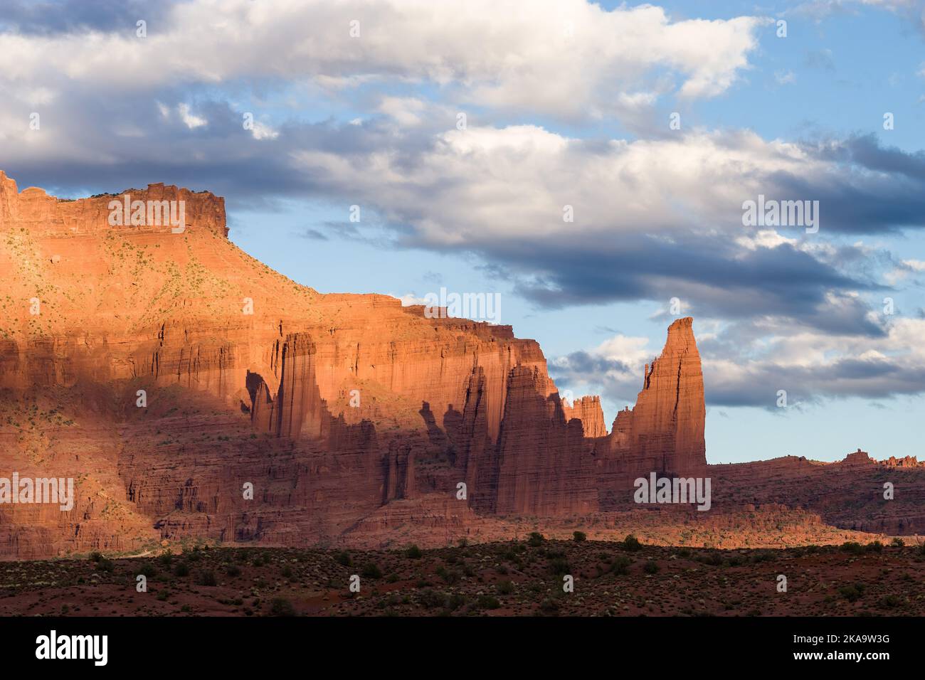 Spotlighting on the Fisher Towers at sunset near Moab, Utah. Kingfisher ...