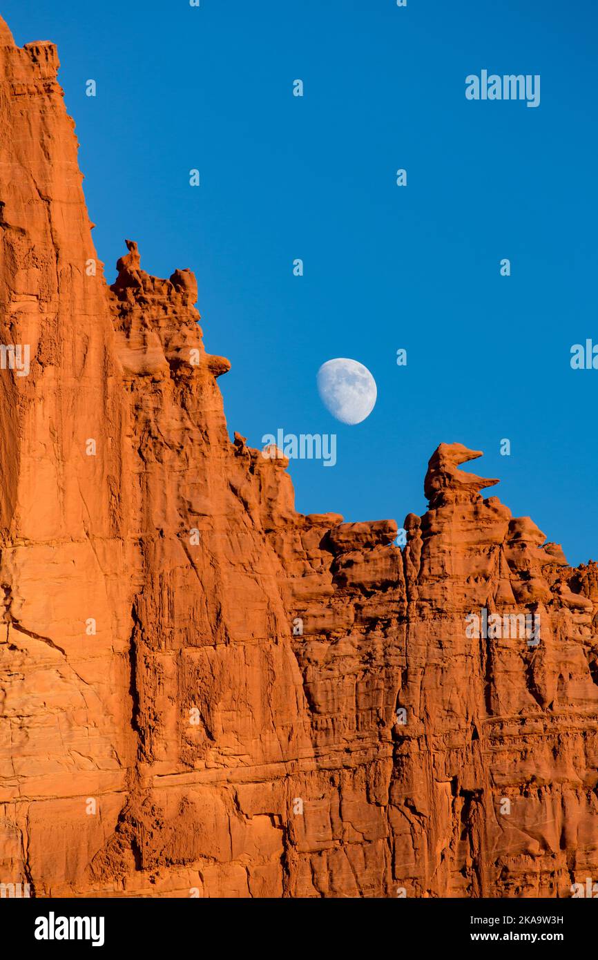 Rising moon between the Saddle and Pac Man in the Fisher Towers, eroded ...