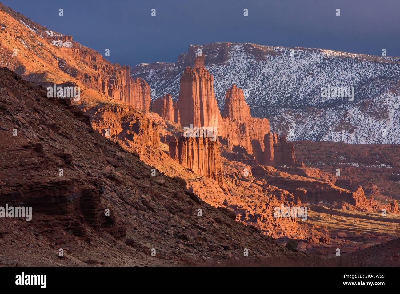 Fisher Towers at sunset in winter with the La Sal Mountains behind ...