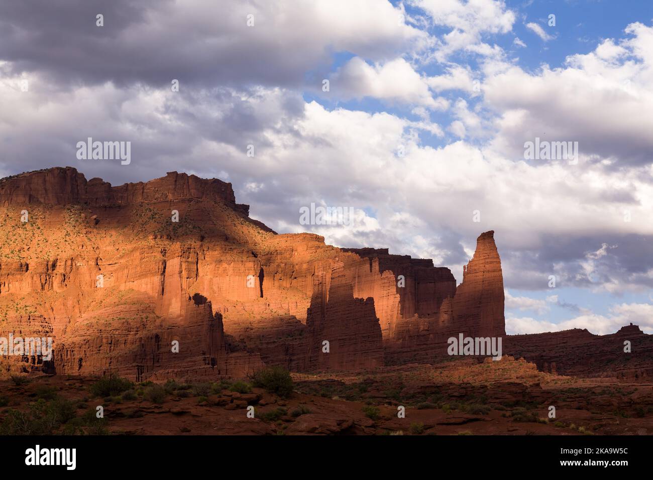 Spotlighting on the Fisher Towers near Moab, Utah. The Titan, at right ...