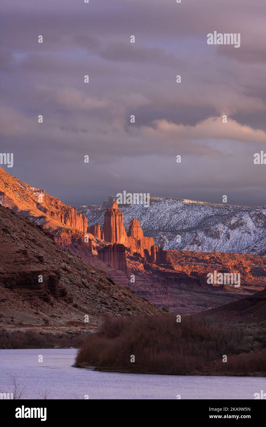 Fisher Towers over the Colorado River at sunset in winter with the La ...
