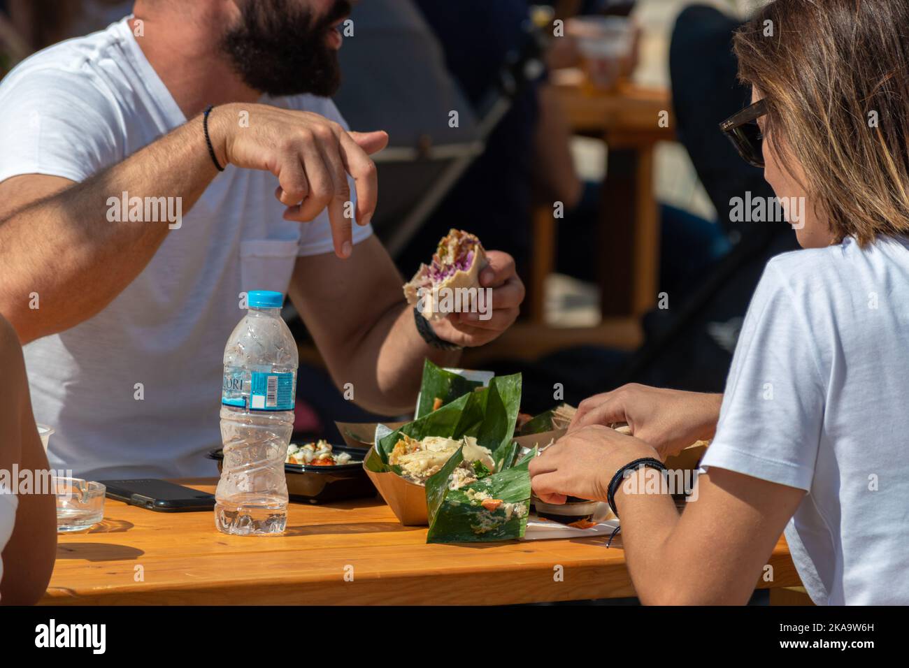 Greece couple eating hi-res stock photography and images - Alamy