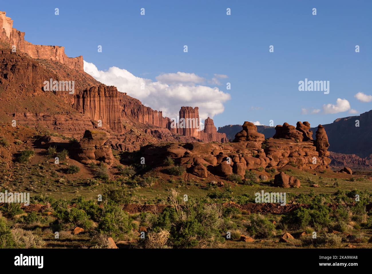 Cutler sandstone rock formations with the Fisher Towers behind near ...