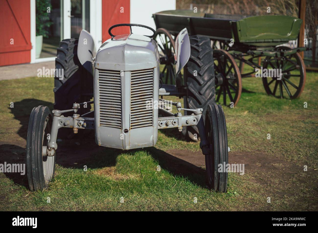 Vintage tractor and cart at the ranch Stock Photo - Alamy