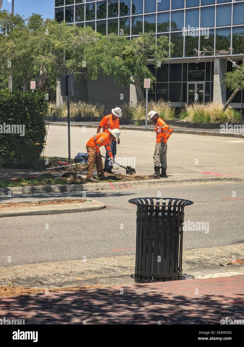 A vertical shot of construction workers working hard outside Stock ...