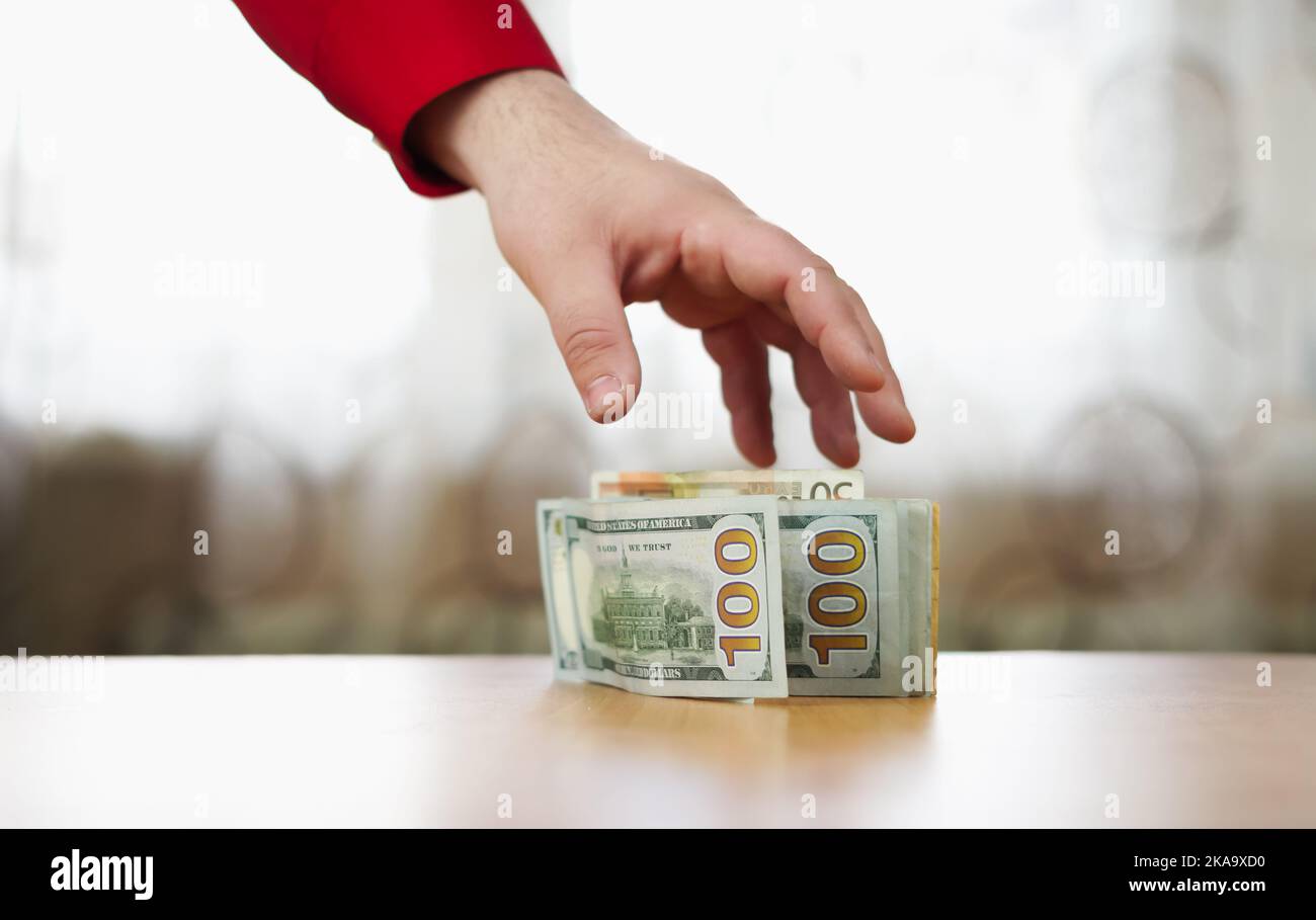 Female hands counting one hundred hi-res stock photography and images ...