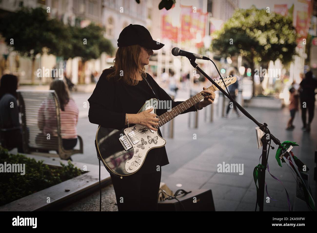 Female singing busker hi-res stock photography and images - Alamy