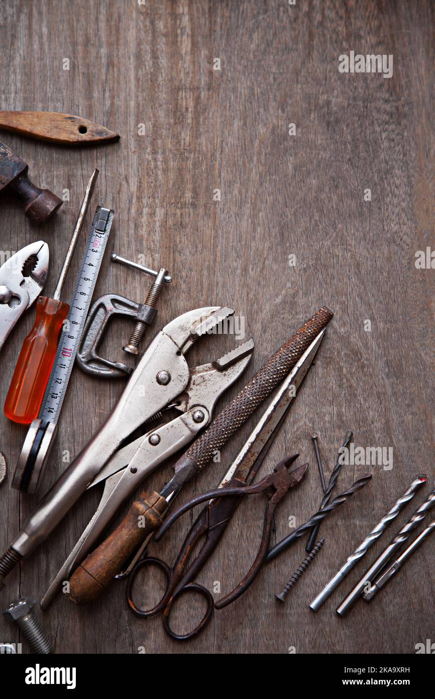 A top view of various tools for repairing on a wooden table Stock Photo ...