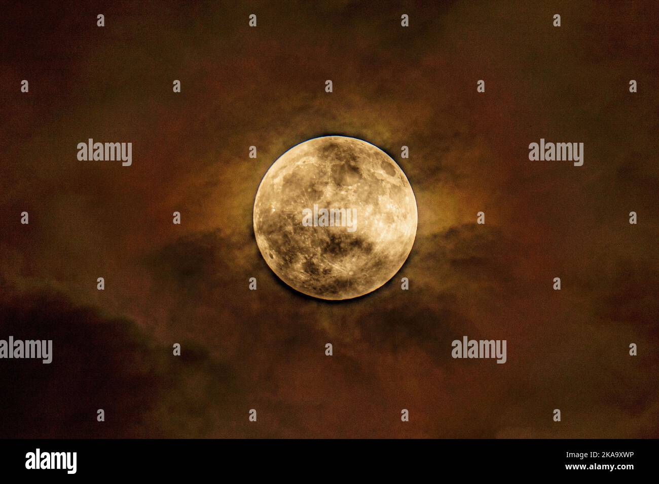 A dramatic sky with clouds and a full moon Stock Photo - Alamy