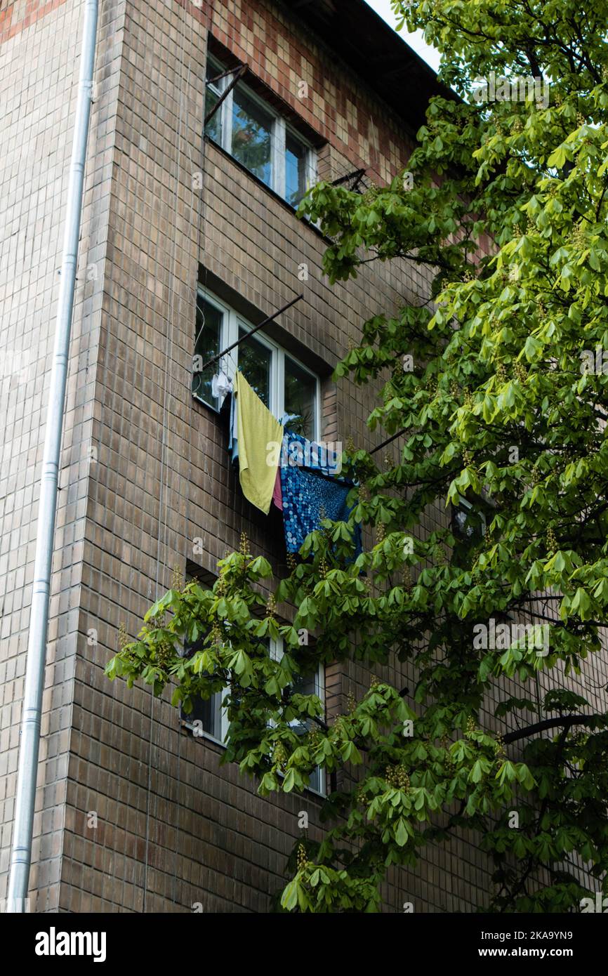 The laundry hanging from the window of the building Stock Photo - Alamy