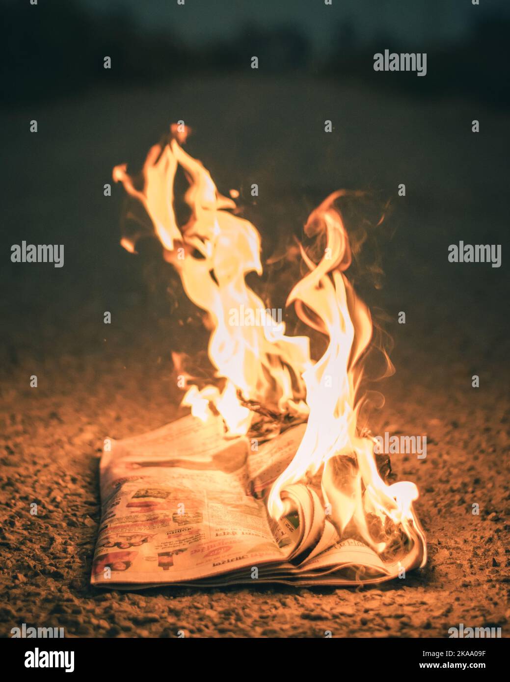 Burning newspaper hi-res stock photography and images - Alamy