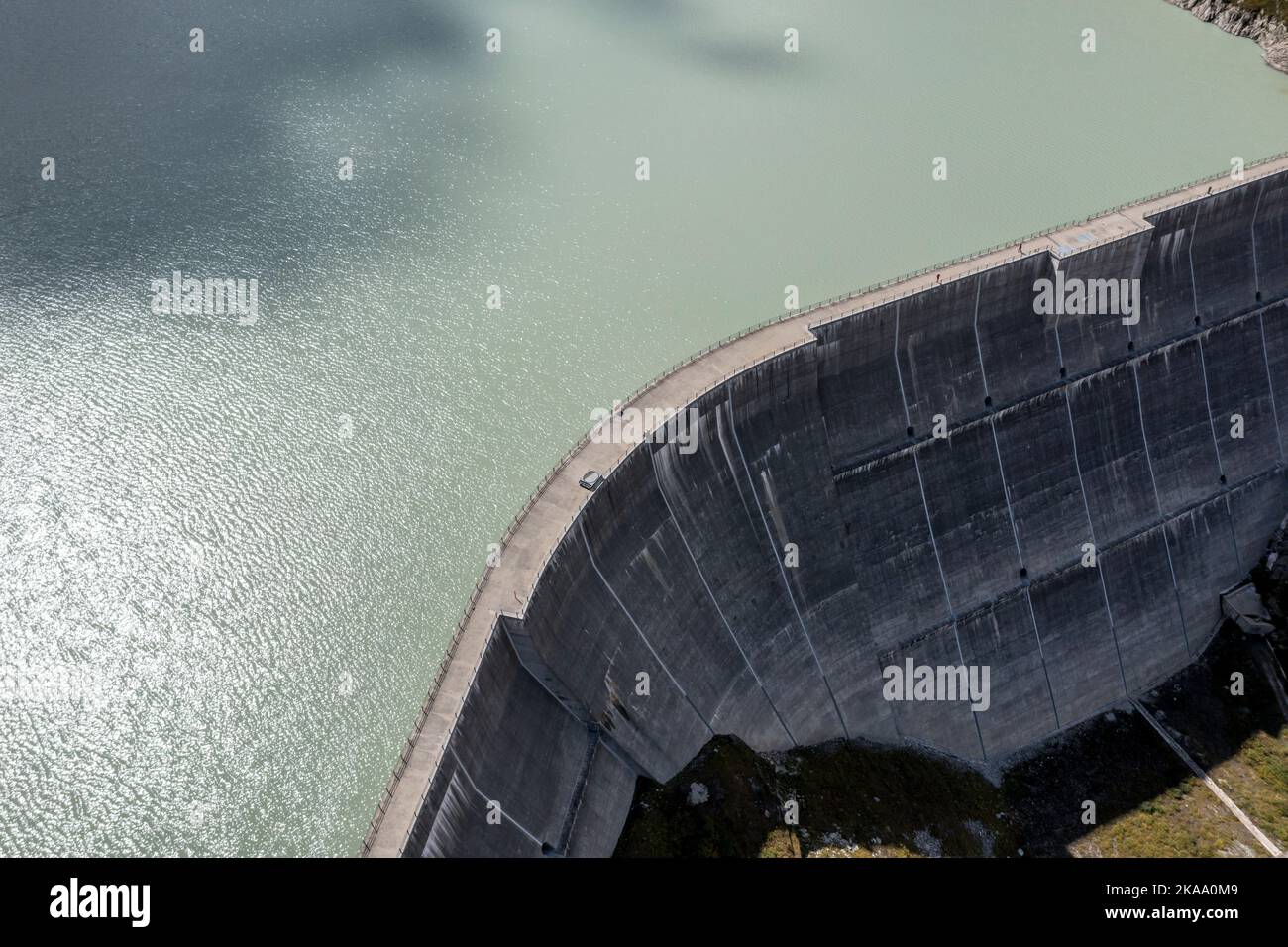 Aerial view of Oberaar hydroelectric reservoir lake, dam, Oberhasli ...