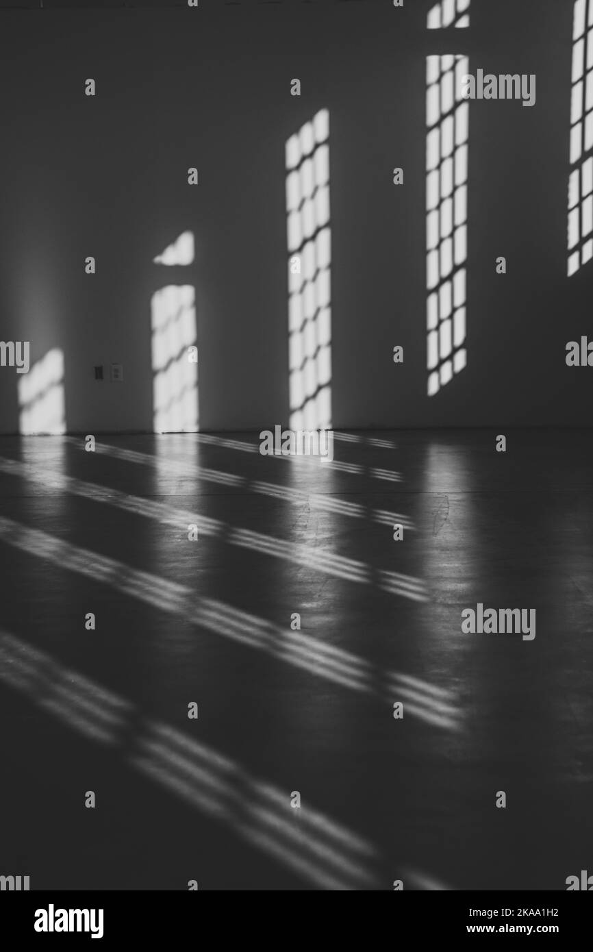 A vertical shot of shadows on the wall in an empty room Stock Photo - Alamy