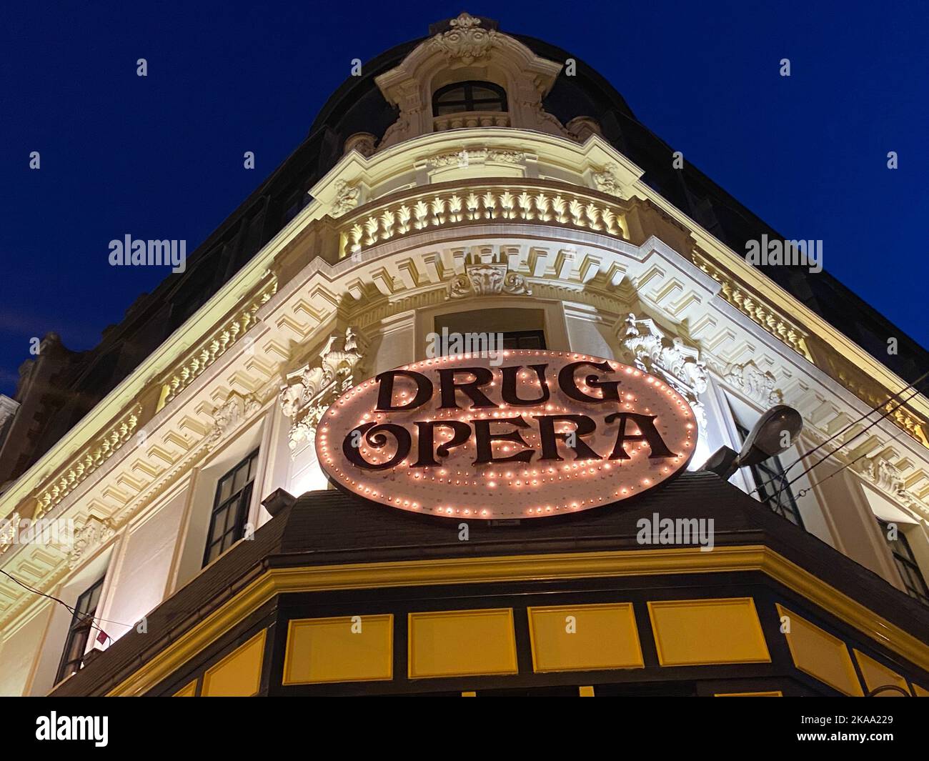 A low angle of Drug Opera building against night sky in Brussels ...