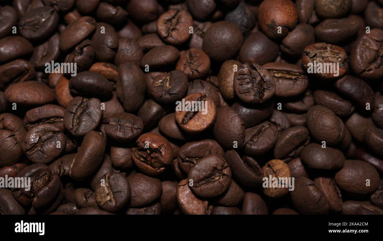 A close-up of coffee beans background Stock Photo - Alamy