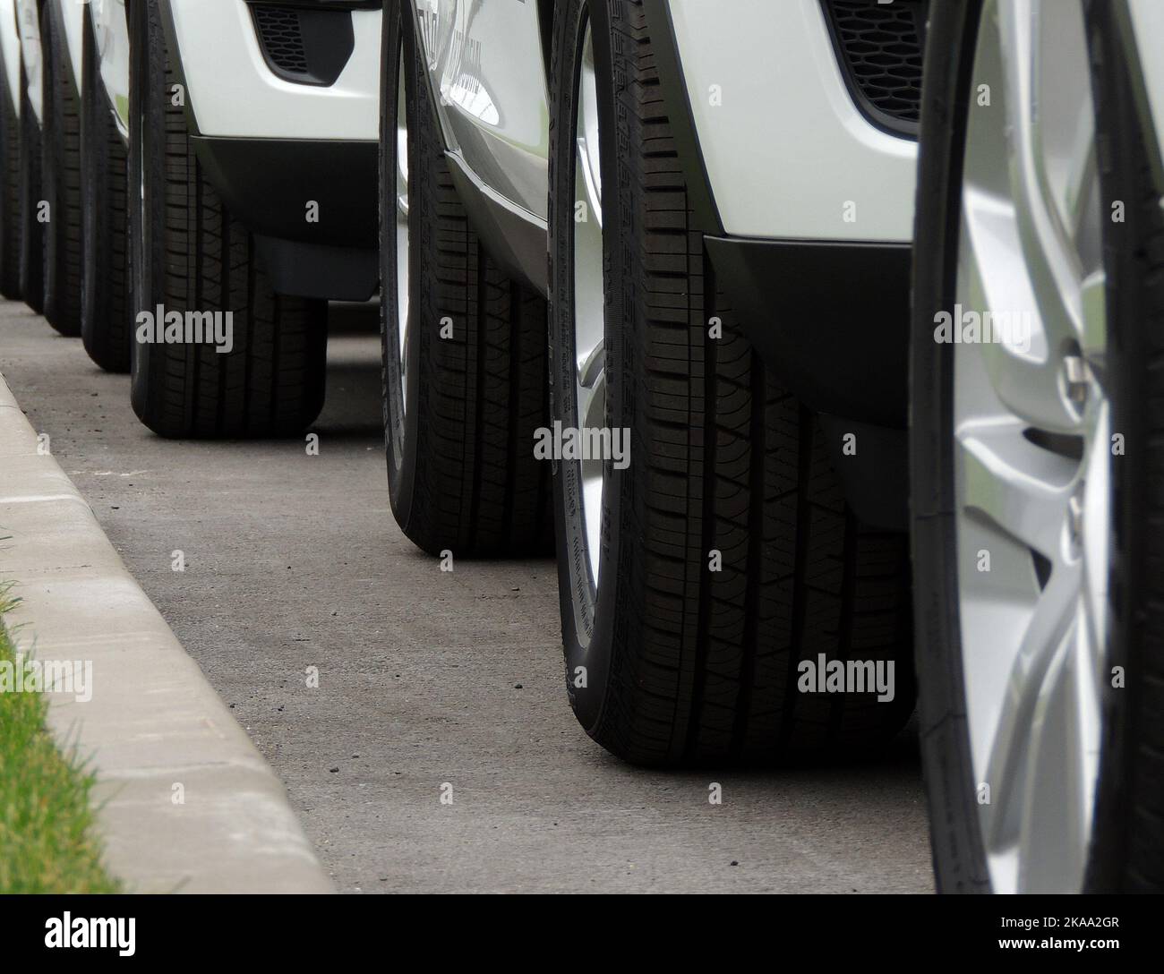 Convoy of the white vehicles pulling out from parking Stock Photo - Alamy