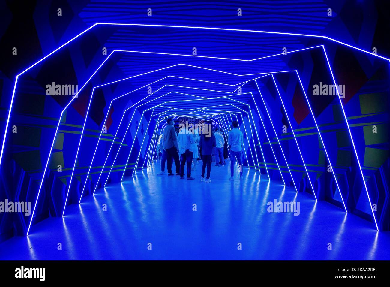 blue light tunnel with people low light with grain Stock Photo - Alamy