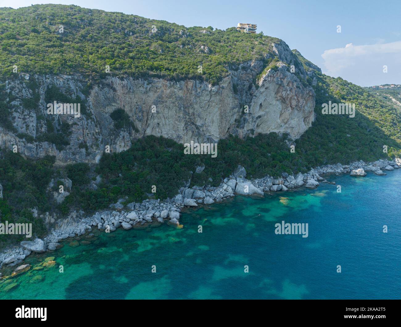 Aerial view of the coastline cliff that lead to Porto Timoni beach ...