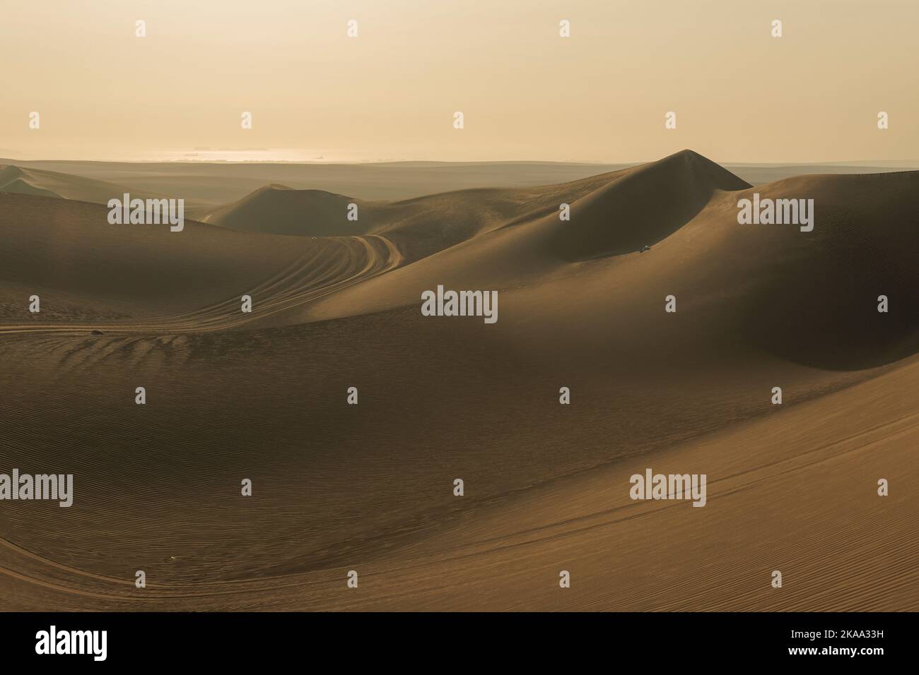 A beautiful daytime view of a desert with high and low dunes in Peru ...