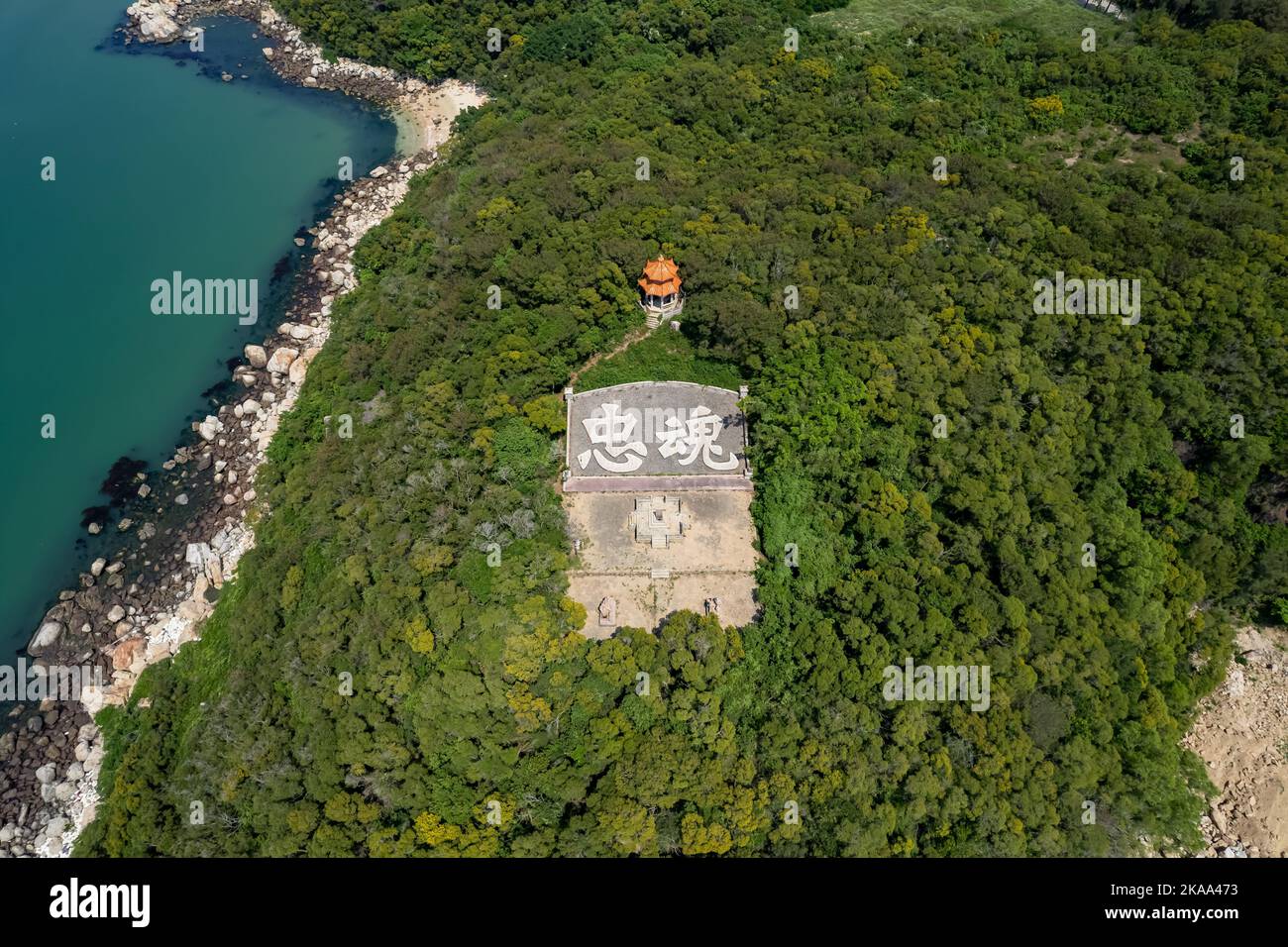 The aerial view of the green shoreline with big Chinese characters near ...