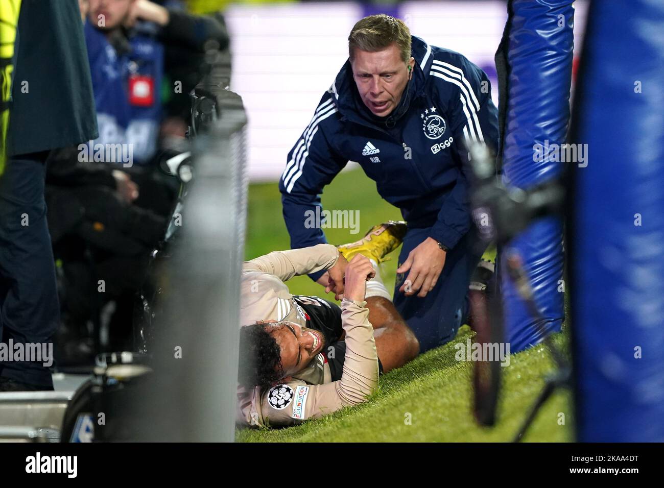 Ajax's Owen Wijndal receives treatment after colliding with the ...