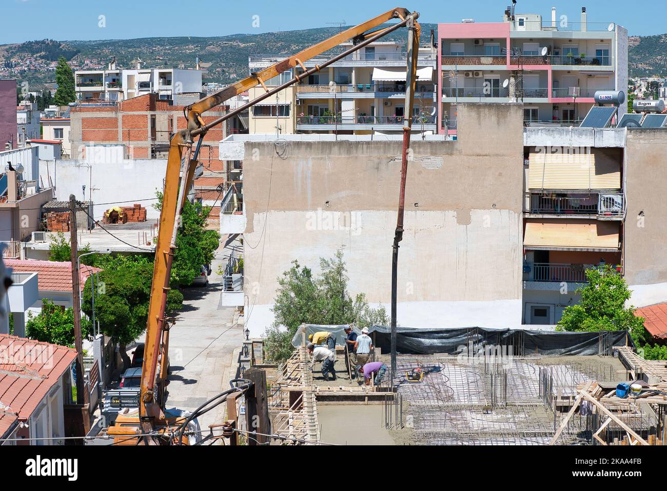 builders workers, build house building in the city center. With the ...