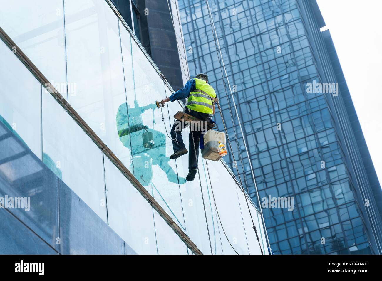 Chongqing, China-July 20th, 2021: chinese worker cleaning windows ...