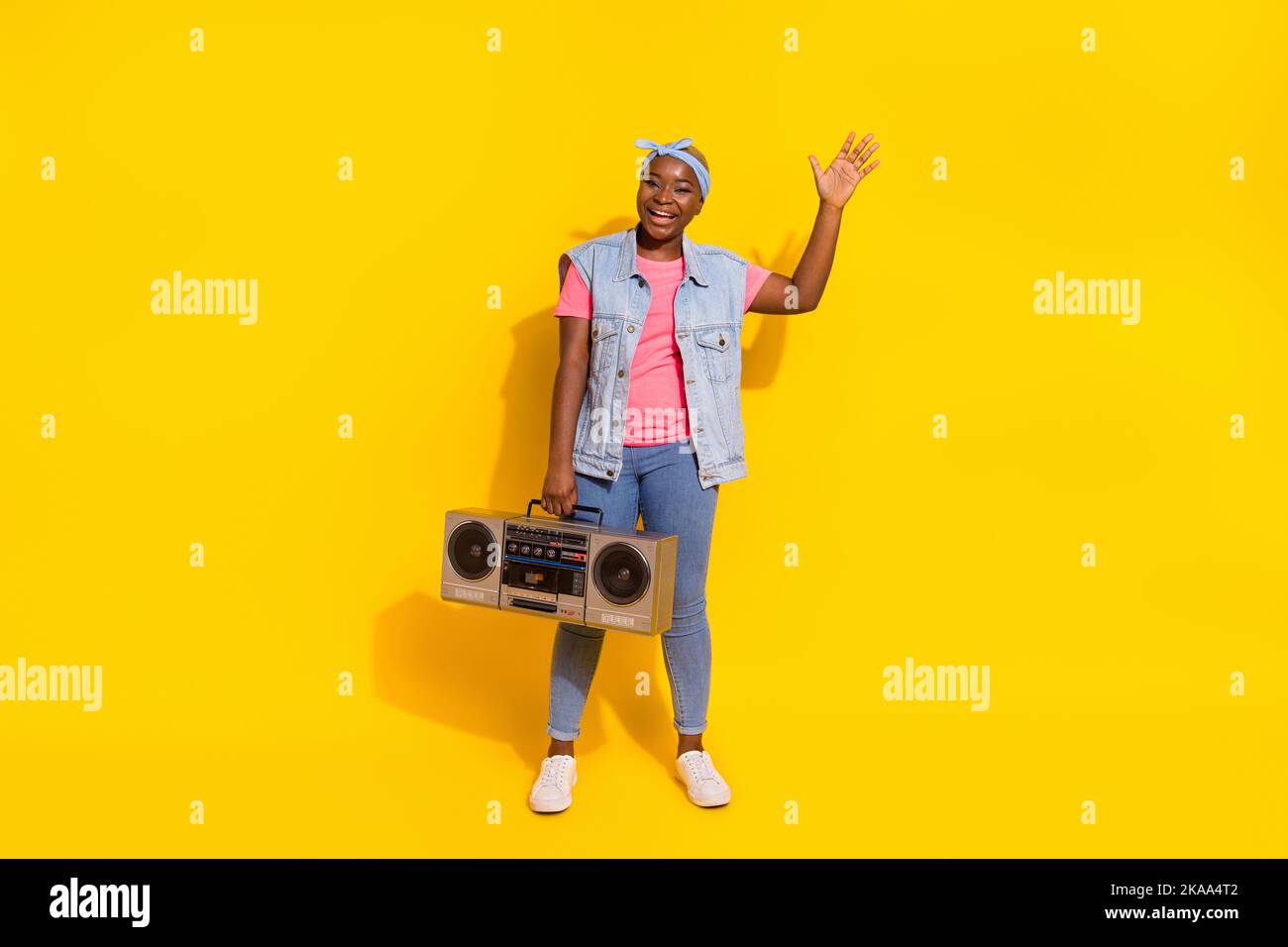 Full size photo of funky person hold boombox raise arm palm waving ...