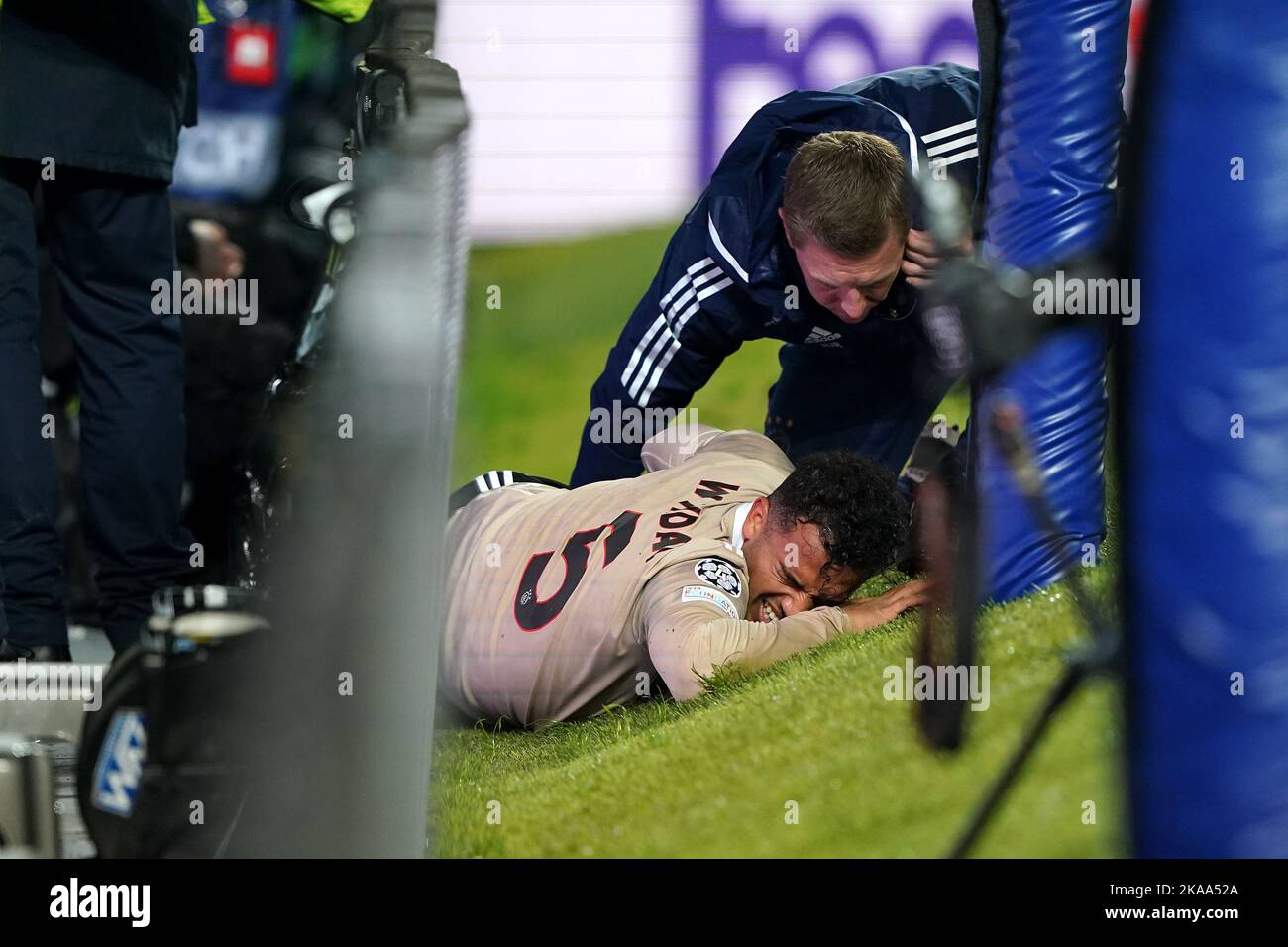 Ajax's Owen Wijndal receives treatment after colliding with the ...