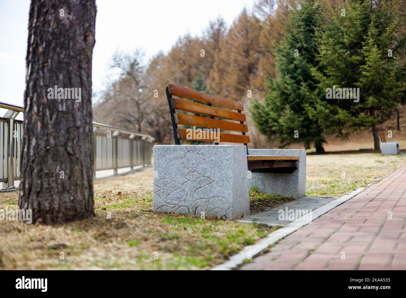 A peaceful scene with a bench in an autumn park, China Stock Photo - Alamy