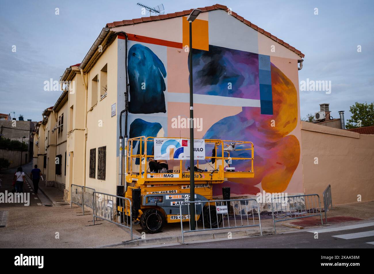 Artist Nulo paints a mural during Asalto International Urban Art ...