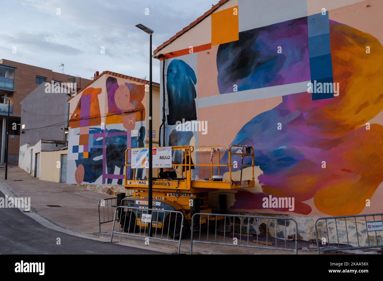 Artist Nulo paints a mural during Asalto International Urban Art ...