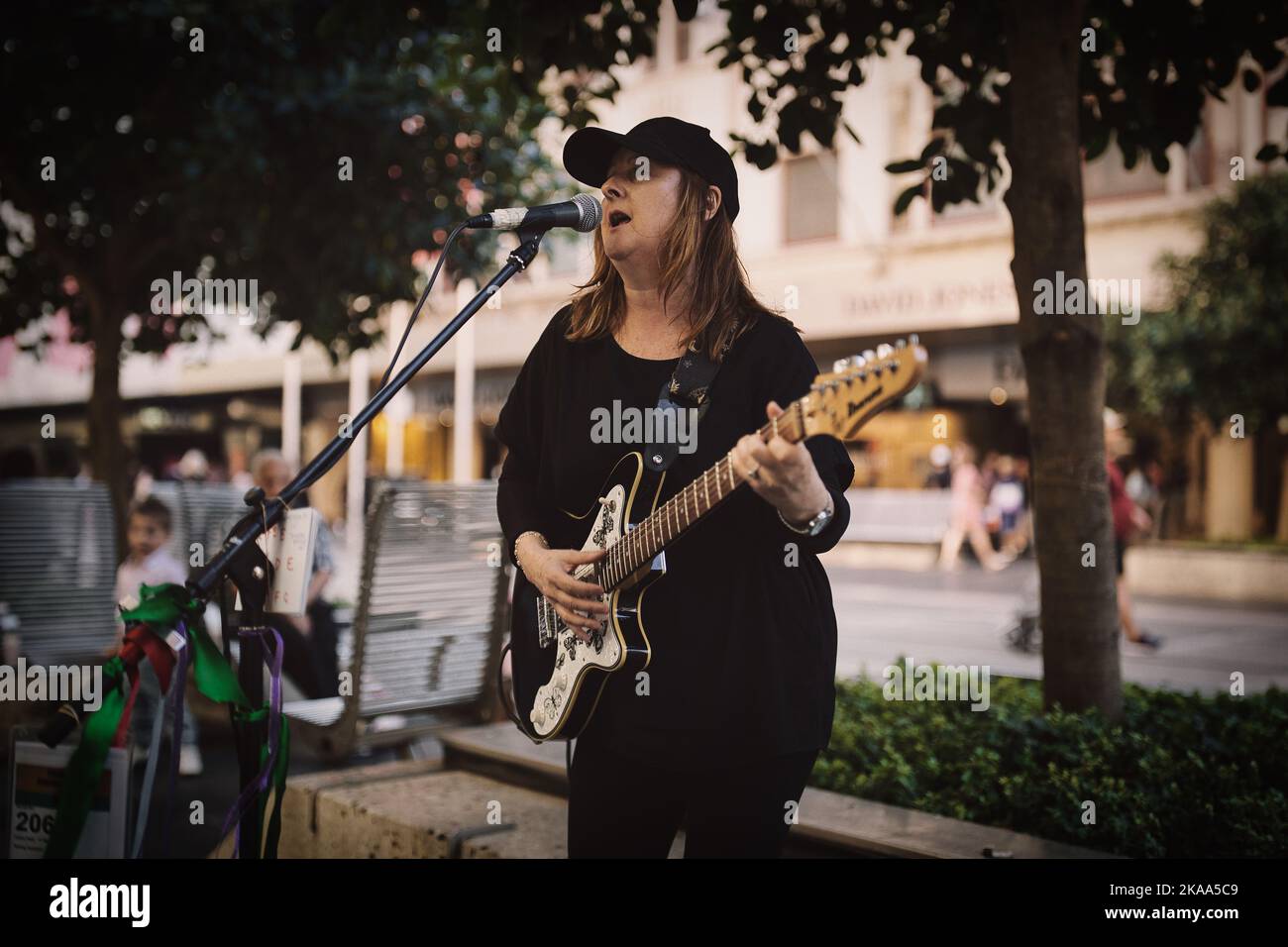 Female singing busker hi-res stock photography and images - Alamy