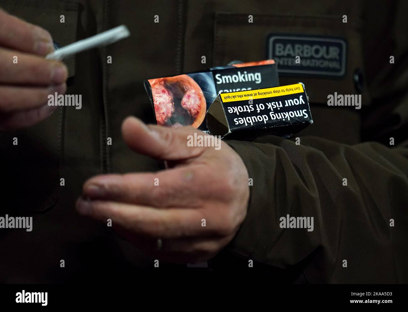 A Napoli fan rolls a cigarette during the UEFA Champions League Group A ...