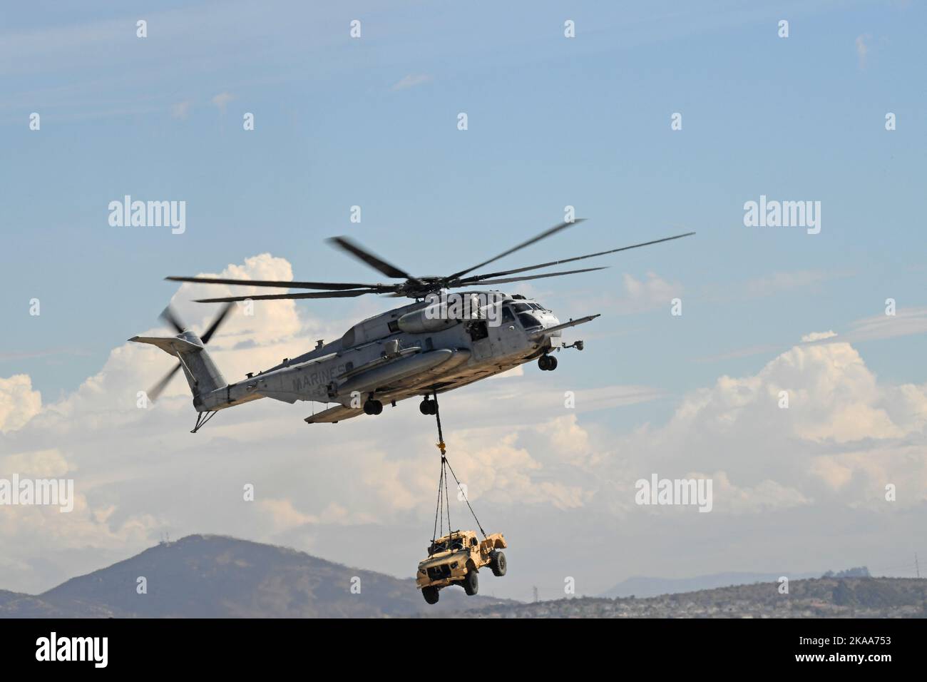 USMC CH-53E Super Stallion helicopter drops off a vehicle aboard MCAS ...