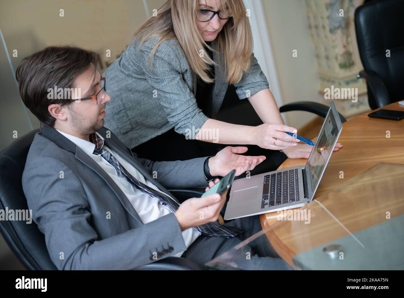 Roundtable meeting of business partners. Business people talking and ...