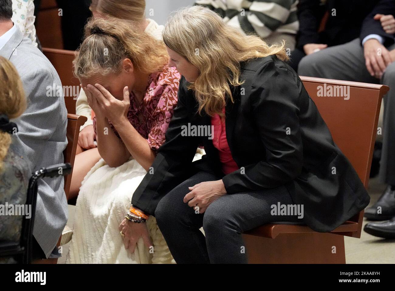 Ft. Lauderdale, USA. 13th Oct, 2022. Debbie Hixon, right, reaches out ...