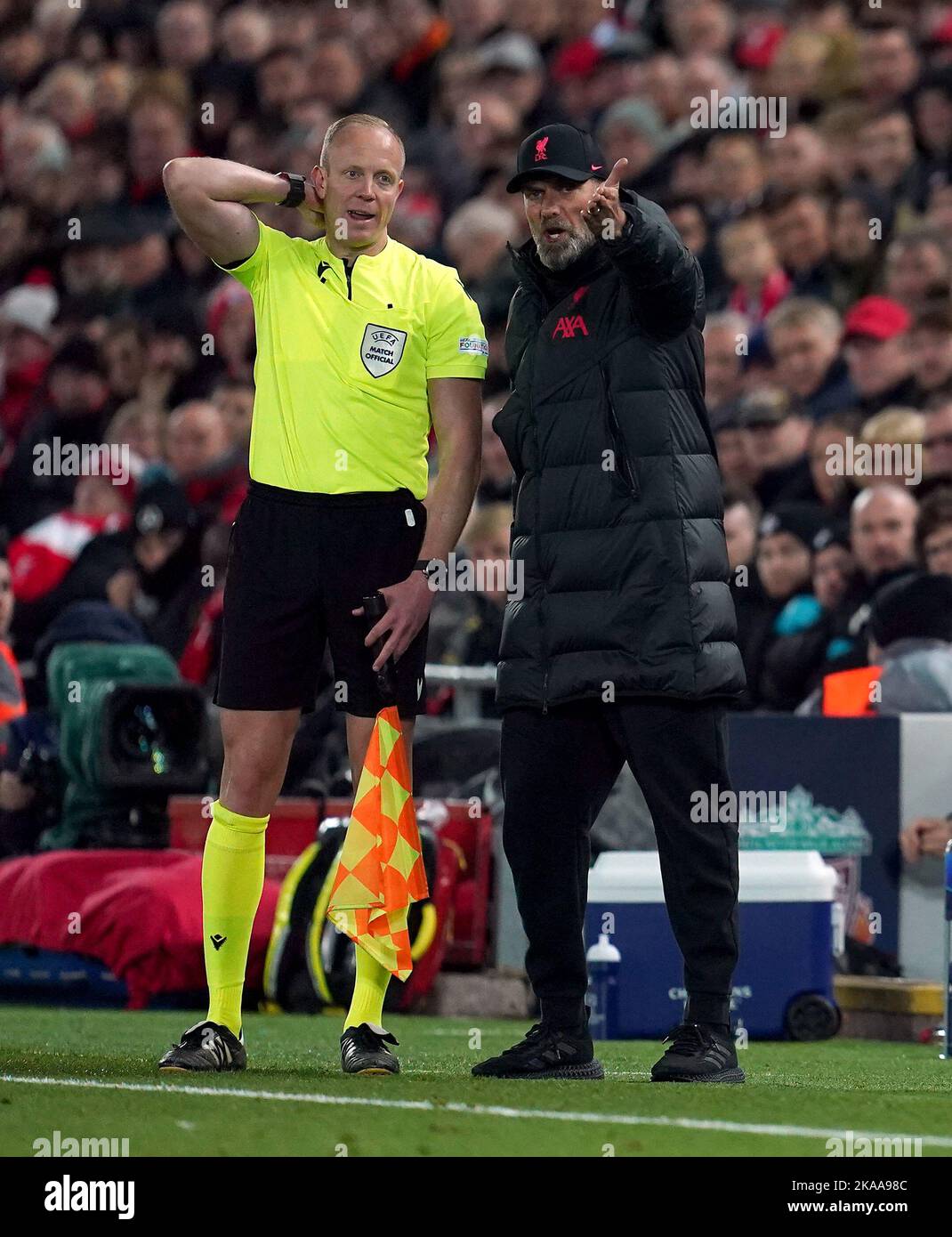 Liverpool manager Jurgen Klopp speaks to an assistant referee during ...