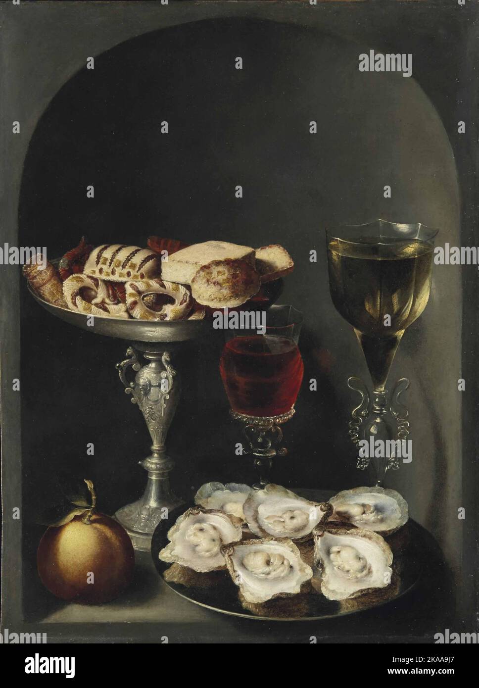 Still life with oysters on a pewter plate and wine glasses in a niche ...