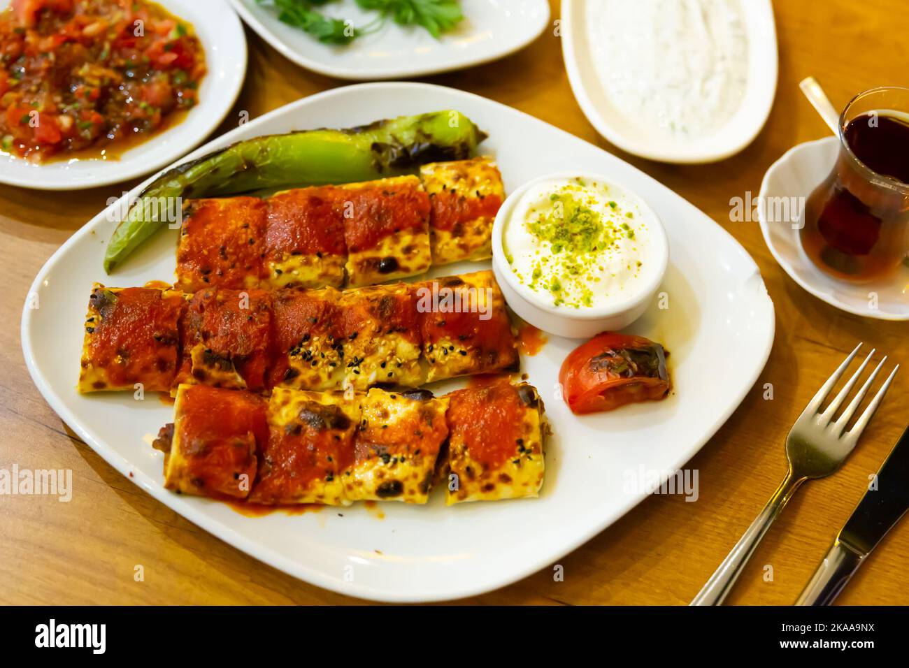 Traditional Turkish beyti sarma from grilled ground beef wrapped in ...