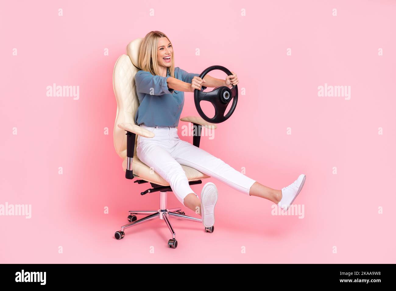 Full size portrait of crazy funky girl sit chair arms hold wheel empty ...