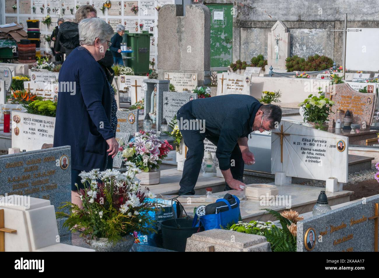 Porto, Portugal. 01st Nov, 2022. A man cleans the family gravestone ...
