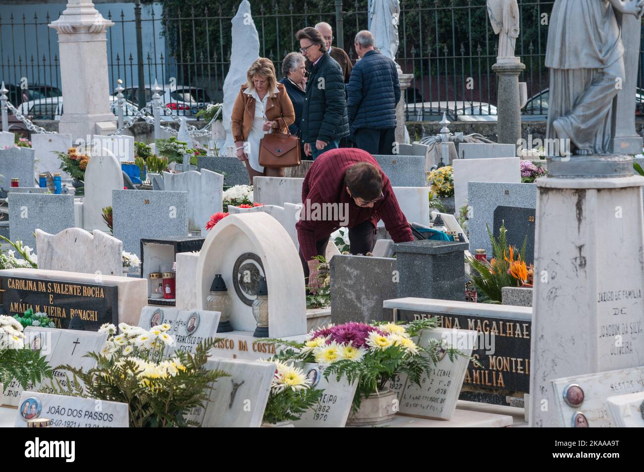 Porto, Portugal. 01st Nov, 2022. A person cleans the gravestone during ...